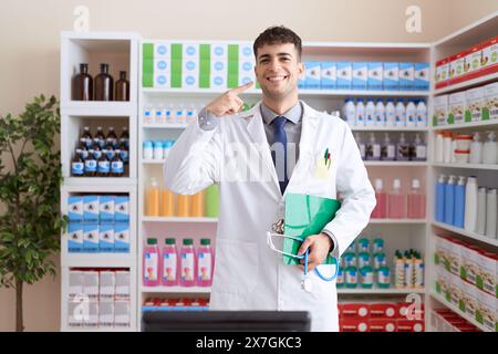 Hispanic man with beard working at pharmacy drugstore approving doing ...