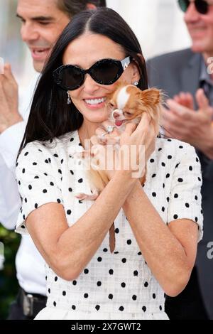 Demi Moore and Pilaf the dog pose at the photo call of 'The Substance ...