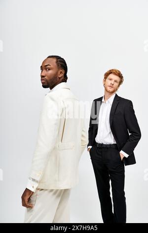 Two multicultural men with elegantly dapper style standing together ...