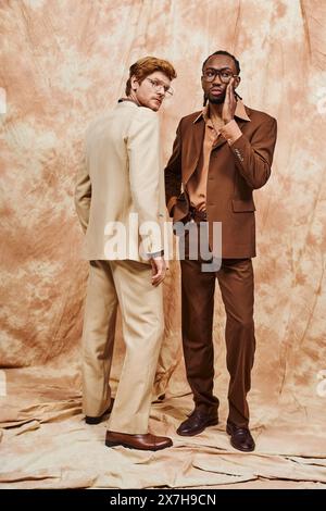 Handsome multicultural men in elegant attire stand beside each other ...