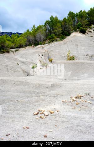 Arid and stony craggy zone with little poor vegetation Stock Photo - Alamy