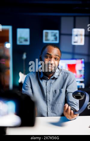 Content creator filming tech tutorial on how to do camera systems V ...