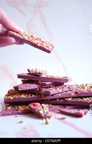 Ruby chocolate made from selected botanical cocoa bean varieties. Dried ...