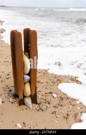 Old, decaying, rusty groyne in the sea, on Vane Tempest Beach in Seaham ...