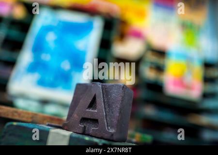 The movable letterpress type "A" is seen placed on the composing table ...
