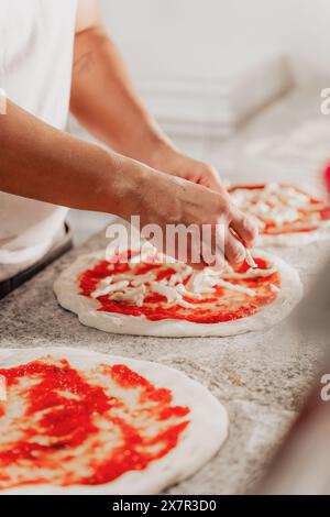 professional chef prepares pizza in a children's restaurant Stock Photo ...