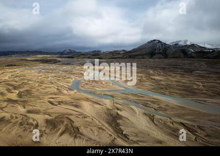Distant aerial view of snow-capped Tatra mountain peaks against ...