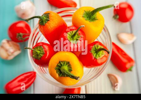 mini bell pepper mix on black background Stock Photo - Alamy