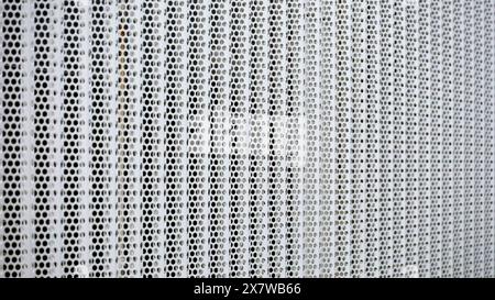White Perforated Metal Panel with an Abstract Square Pattern ...