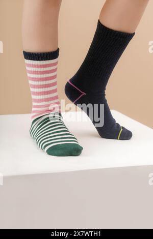 Odd socks day concept. Mismatch socks at blue Stock Photo - Alamy