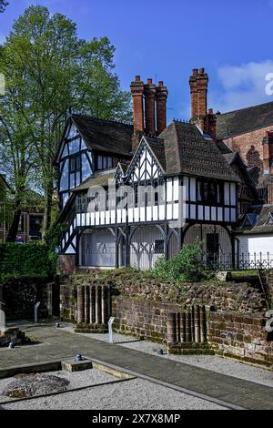 Lychgate Cottages, intact reminders of medieval priory, beside ruins of ...