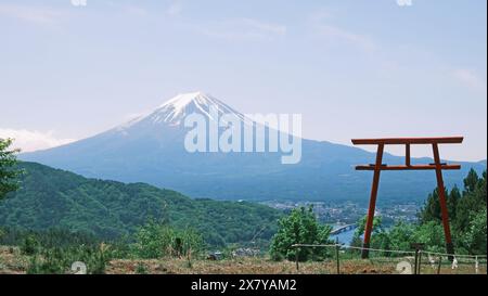 a traditional red Torri gate in front of the fuji mountain Stock Photo ...