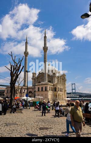 Visit Istanbul concept. Ortakoy Mosque and tourists while sightseeing ...