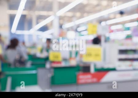 Blur cashier checkout counter in the supermarket Stock Photo - Alamy