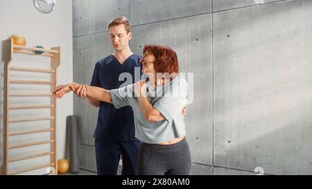 Senior physiotherapy man working at pain recovery clinic with hand on ...