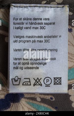 washing care symbols instructions label in 100% cotton hoodie garment ...