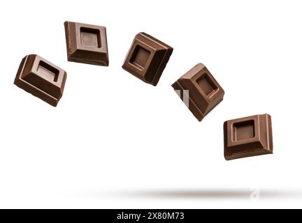 Chocolate blocks and pieces of chocolate bar isolated on a white ...