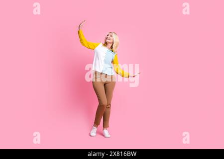 Photo of funky young blond lady yell wear sweater jeans isolated on ...