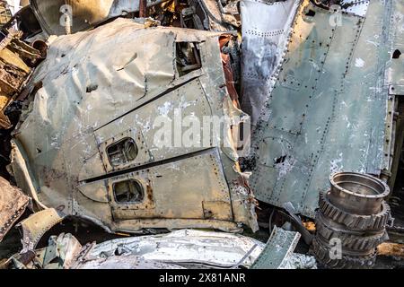 A pile of steel parts from the fuselage and wings of a damaged aircraft ...