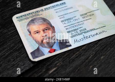 German identity card with businessman around 50 years old lies on a ...