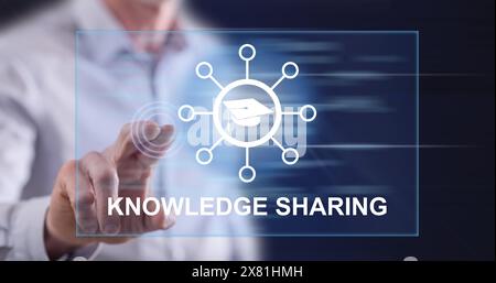 Man touching a knowledge sharing concept on a touch screen with his ...