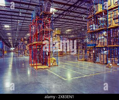 A stocked warehouse with shelving and boxes Stock Photo - Alamy
