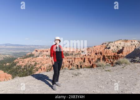 Tourist posing for photos at Bryce Canyon Rim Trail. Utah. USA Stock ...