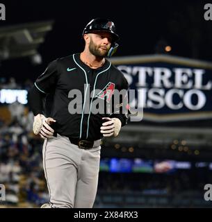 Arizona Diamondbacks' Christian Walker, left, scores a run as ...