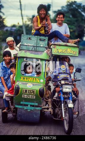 Philippines, Mindanao; motorcycle with sidecar taxis or tricycles can ...