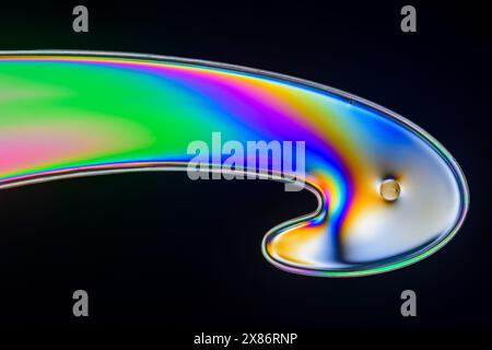 A Rotring clear plastic french curve drawing aid viewed between crossed ...