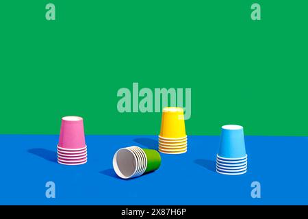Paper cups stacked against two tone colored background Stock Photo - Alamy