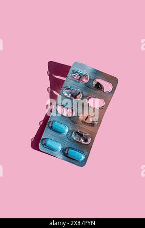 Pink tablets pill in blister pack. Painkiller medicine for treatment ...