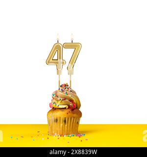 Cupcake with birthday candle number 47 - Anniversary card on blue and ...