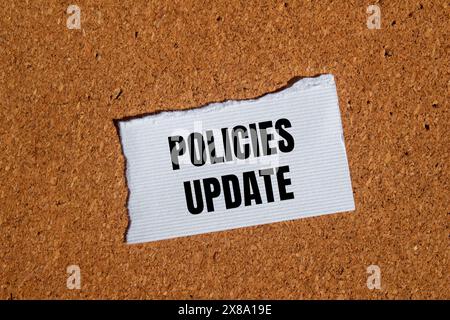 Policies update words written on wooden blocks with green background. Conceptual policies update ...