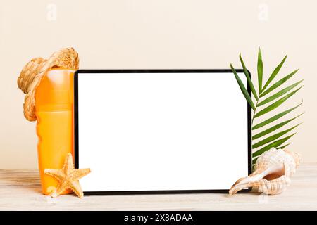 Flat lay composition with tablet and beach accessories on colored ...