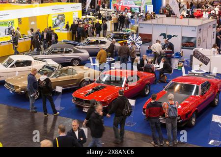 Visitors to Techno Classica take a look at Porsche 911 models. Techno ...