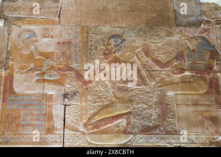 Bas-relief, Pharaoh Seti I (center), God Amun (left), Temple of Seti I ...