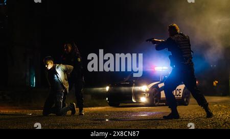 Two Police Officers Catch and Arrest Suspect. Cops Aiming Guns ...
