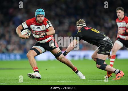 Gloucester Rugby's Zach Mercer is tackled by Hollywoodbet Sharks' James ...