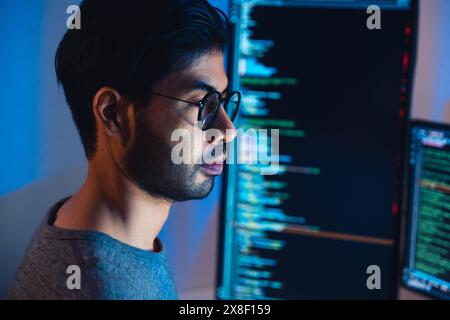 Indian software development working on coding computer screen and ...