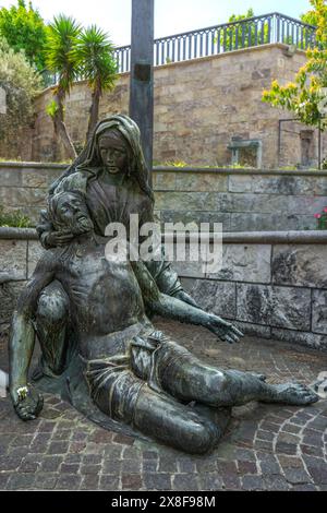 The episodes of Christ's calarion are told with bronze sculptures along ...