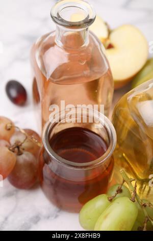 Different types of vinegar on light table, closeup Stock Photo - Alamy