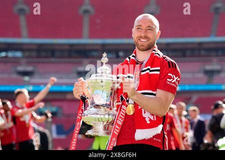 Manchester United's Christian Eriksen celebrates with the trophy after ...