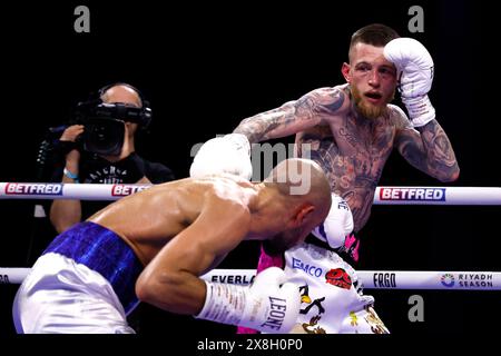 Gary Cully (right) in action against Francesco Patera in the light bout ...