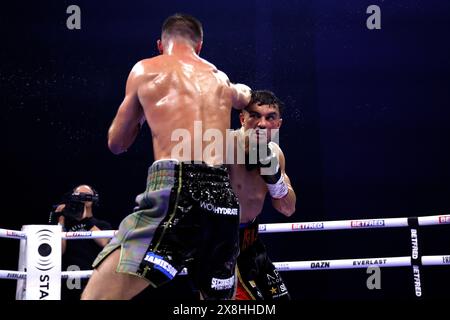 Josh Taylor (left) in action against Ekow Essuman in the WBO Global Welterweight bout at the OVO ...