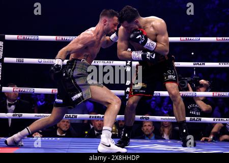 Josh Taylor (left) in action against Ekow Essuman in the WBO Global Welterweight bout at the OVO ...
