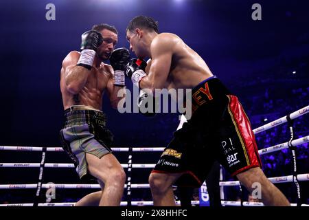 Josh Taylor (left) in action against Ekow Essuman in the WBO Global Welterweight bout at the OVO ...