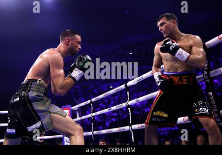 Josh Taylor (left) in action against Ekow Essuman in the WBO Global Welterweight bout at the OVO ...