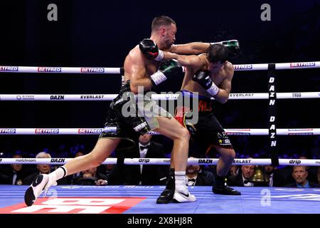 Josh Taylor (left) in action against Ekow Essuman in the WBO Global Welterweight bout at the OVO ...