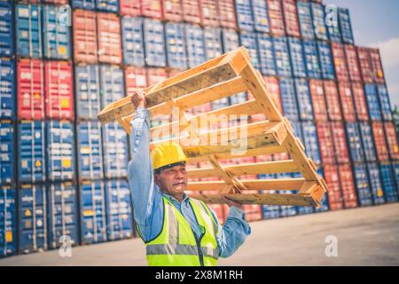 Engineer wears PPE checking container storage with cargo container ...